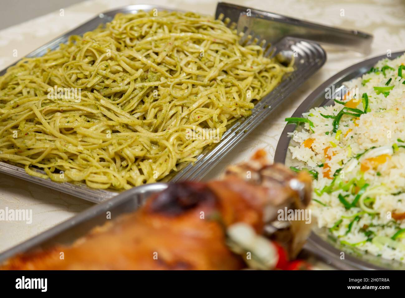 Plates with rice and pasta on a buffet table for a birthday party Stock ...