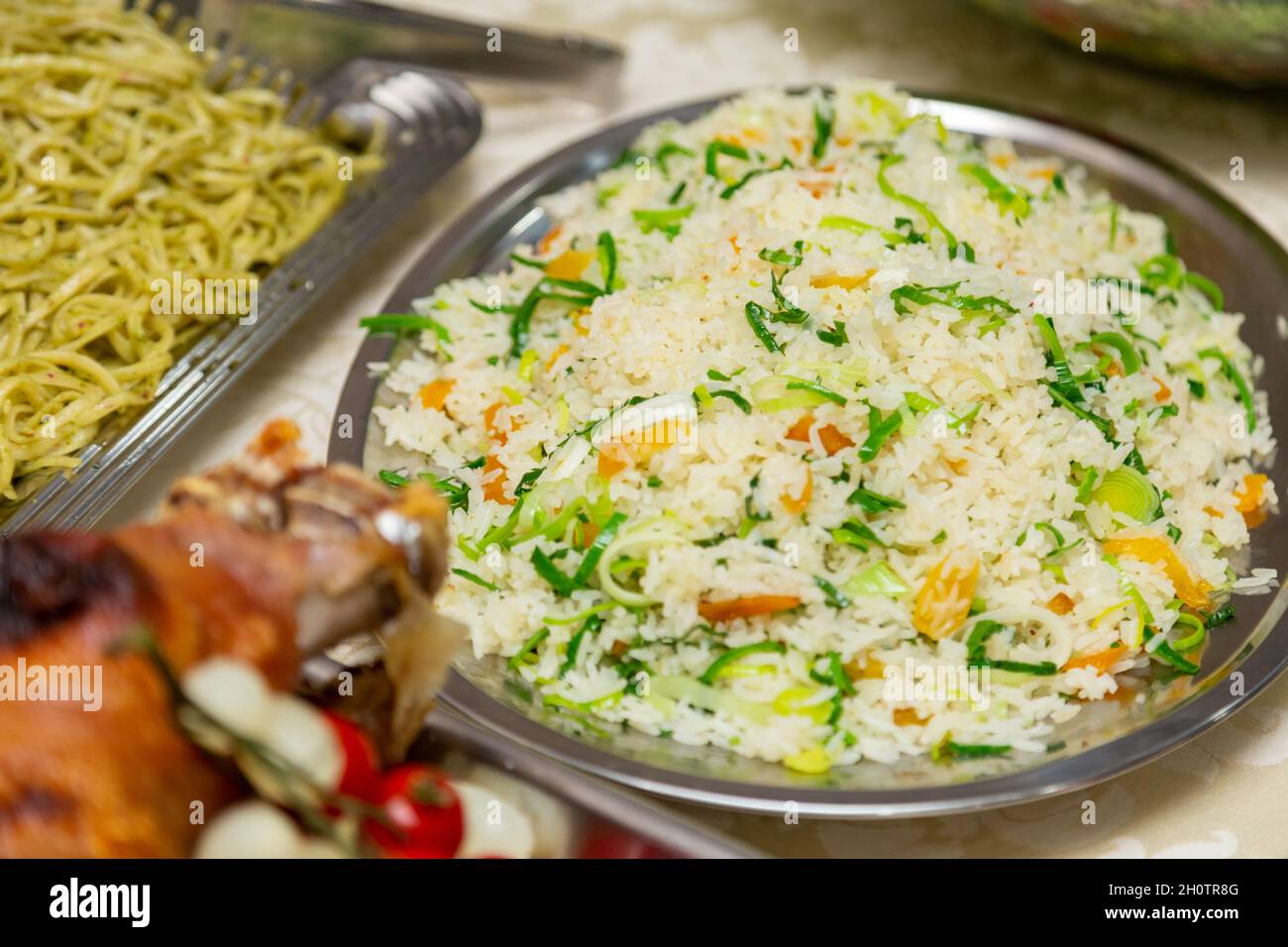 Plates with rice and pasta on a buffet table for a birthday party Stock ...