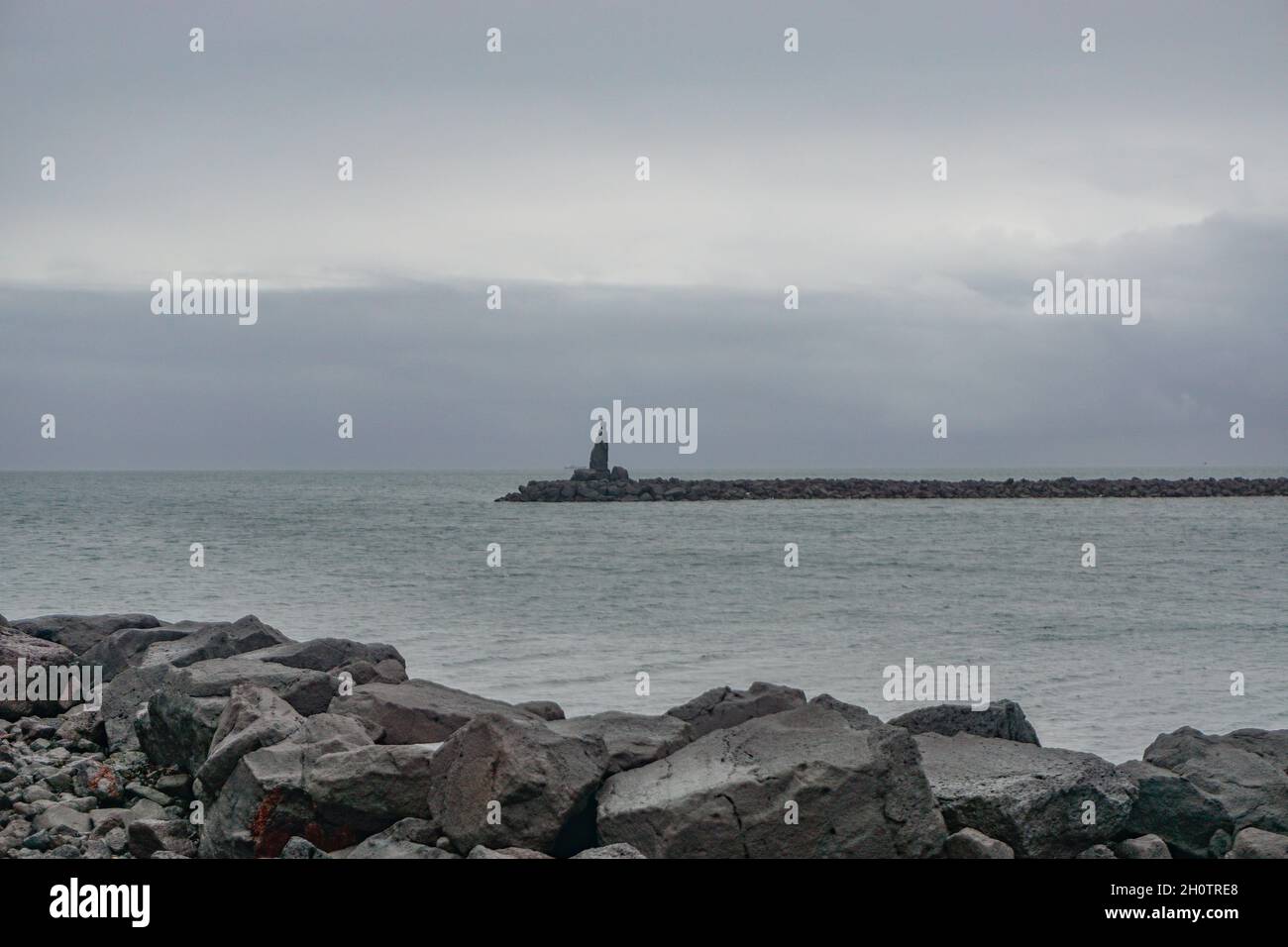 Njardvik, Iceland: A stone sculpture of a troll guards the entry to ...