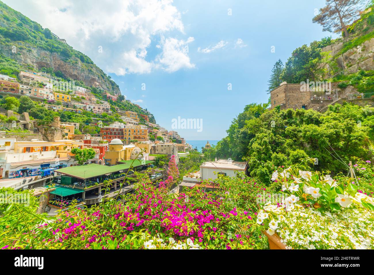 Positano shoreline under a blue sky with clouds. Amalfi coast, Italy ...