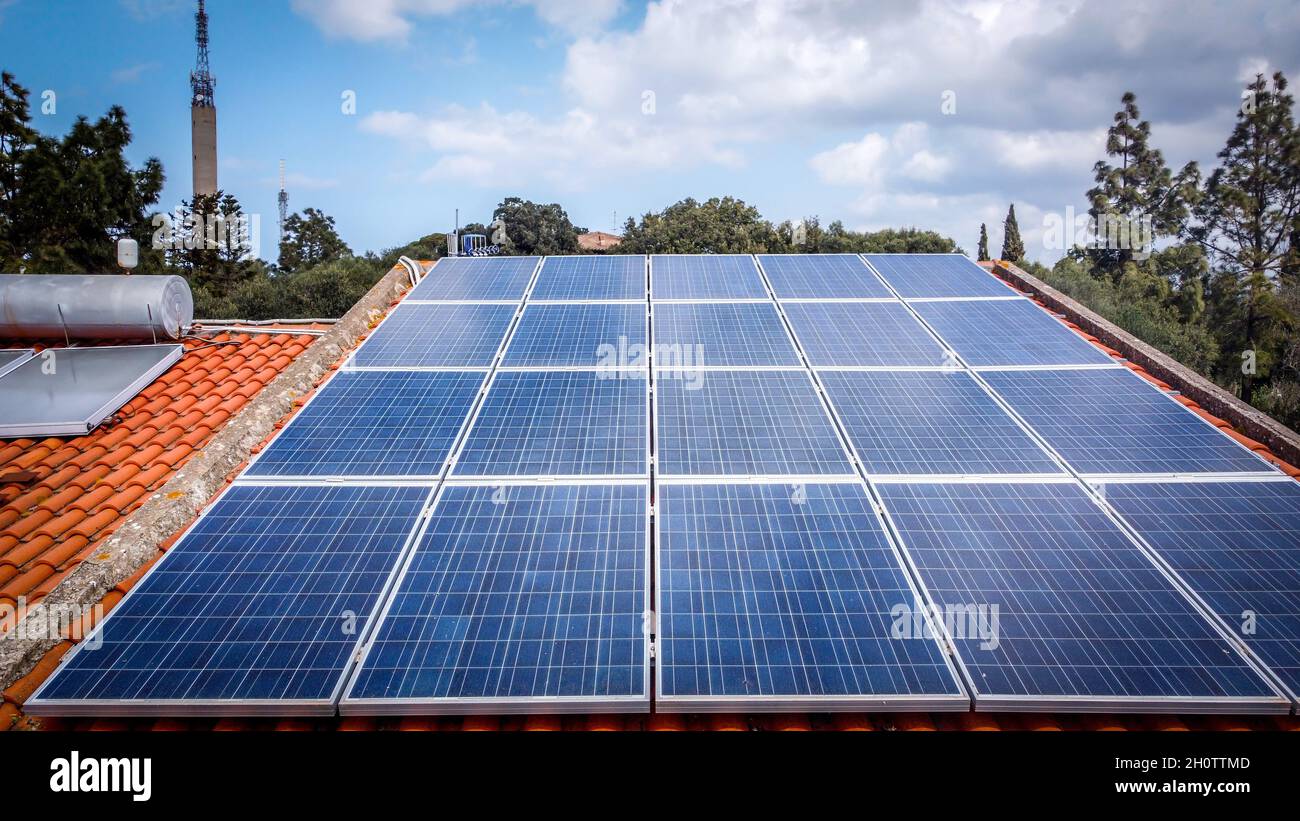 Top view of building rooftop with solar energy collector panels hi-res ...