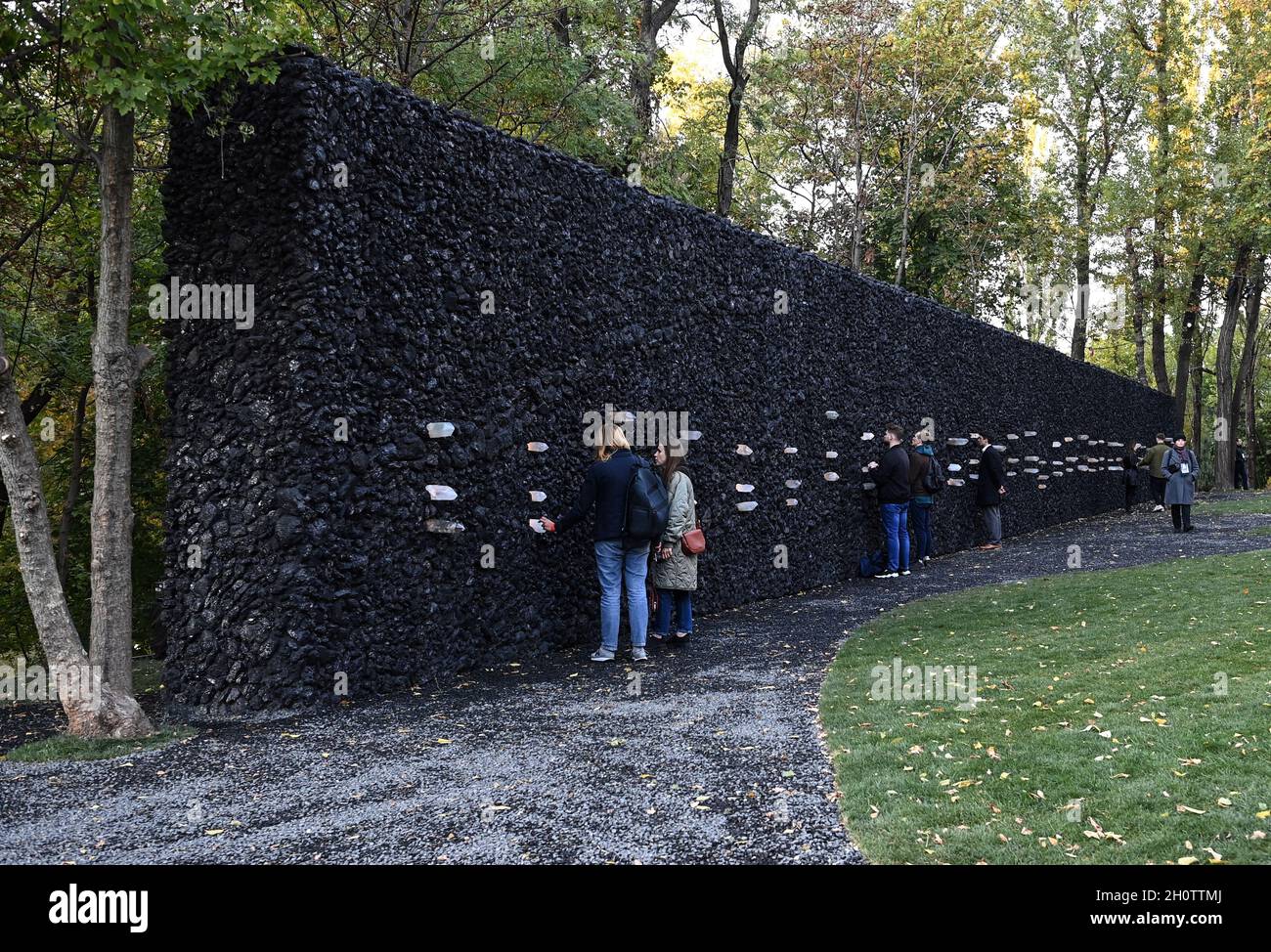 Kiew, Ukraine. 06th Oct, 2021. Visitors stand at the "Crystal Wall of ...