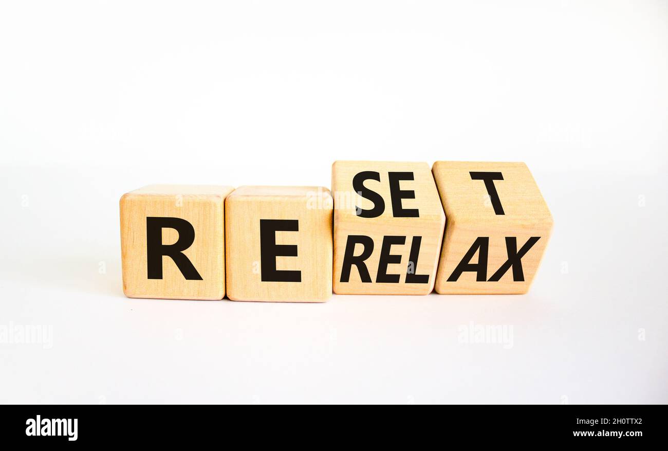 Relax and reset symbol. Businessman turned cubes and changed the word ...