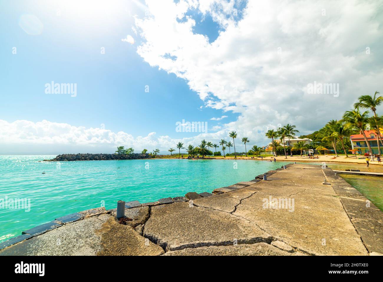 Cement jetty in Bas du Fort beach in Guadeloupe, Caribbean sea Stock ...
