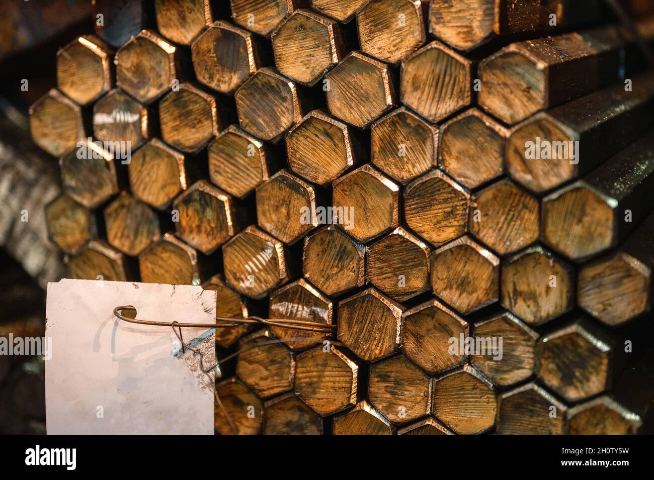 Bundle of hexagonal metal rods, hot rolled steel Stock Photo - Alamy