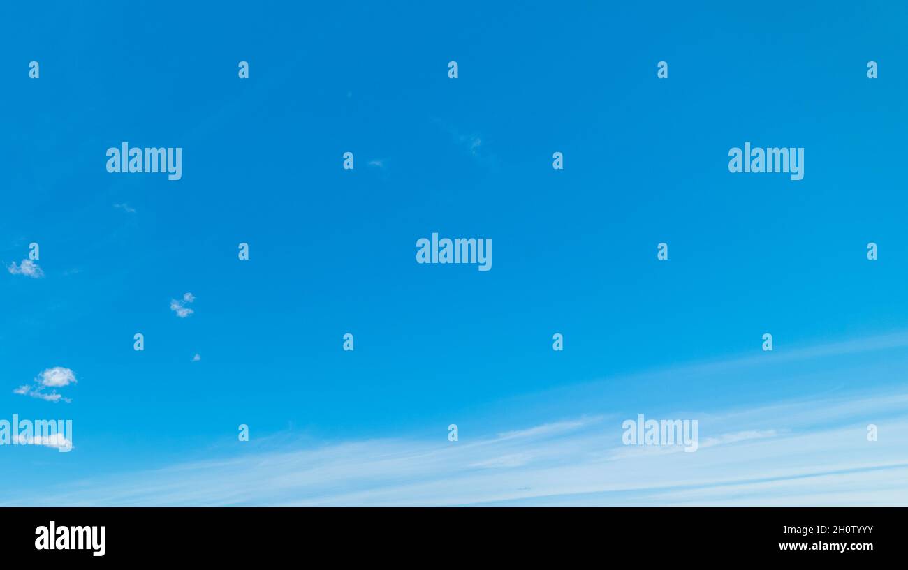 Blue sky with small clouds in summertime Stock Photo - Alamy