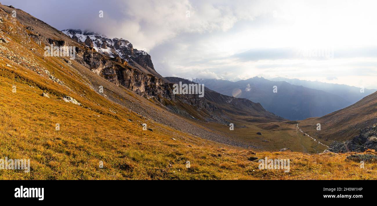 A panoramic photo of a mountain and it's valley on a beautiful sunset ...