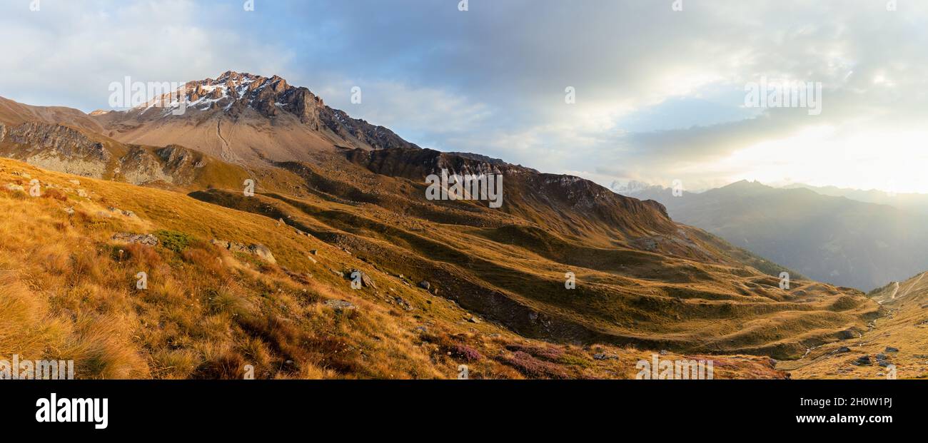 A panoramic photo of a mountain and it's valley on a beautiful sunset ...