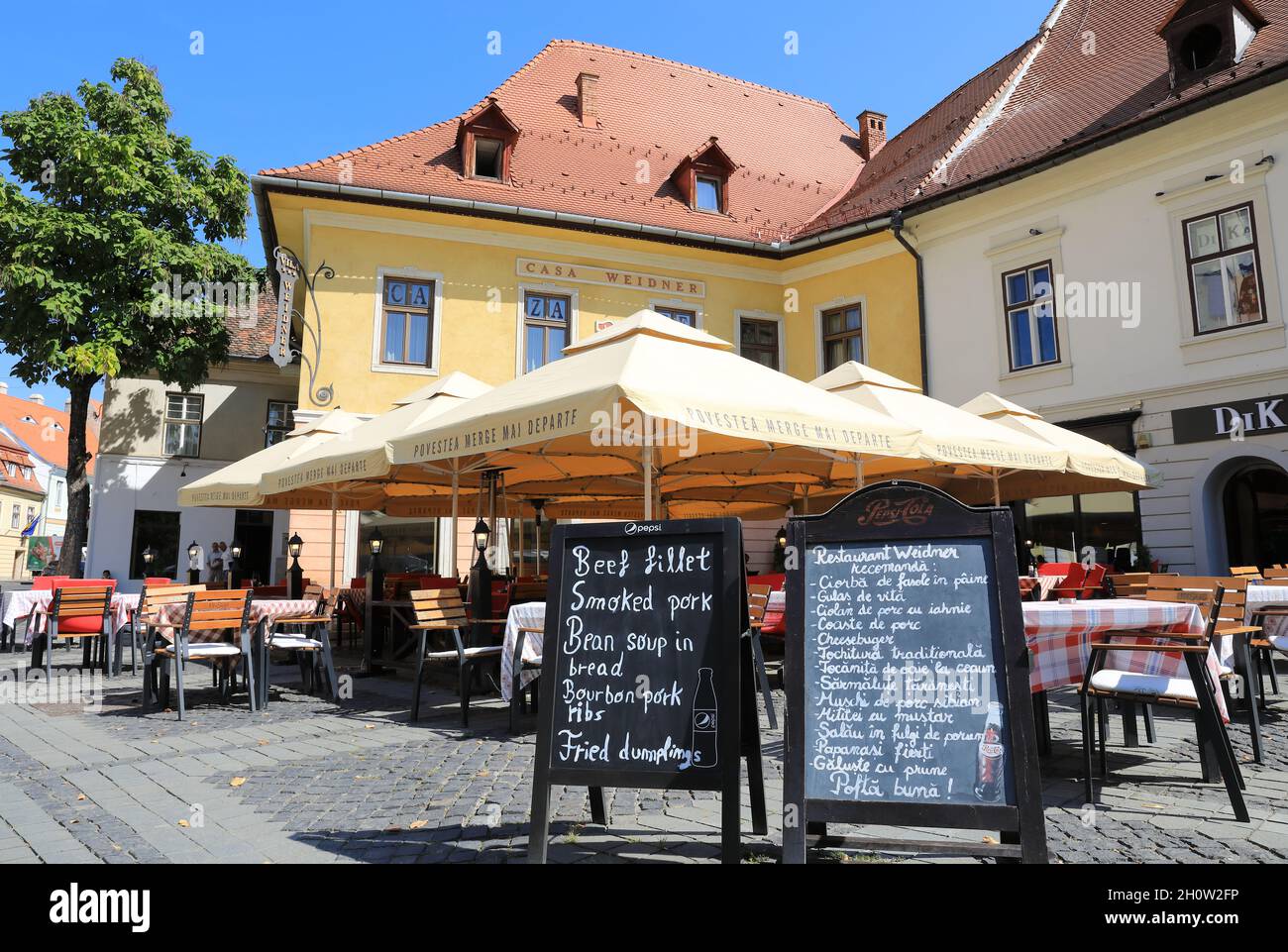 Traditional restaurant in the corner of Piata Mare, in the historic ...