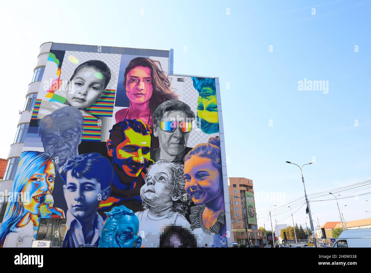 Street murals in the city of Sibiu, Transylvania, Romania Stock Photo ...