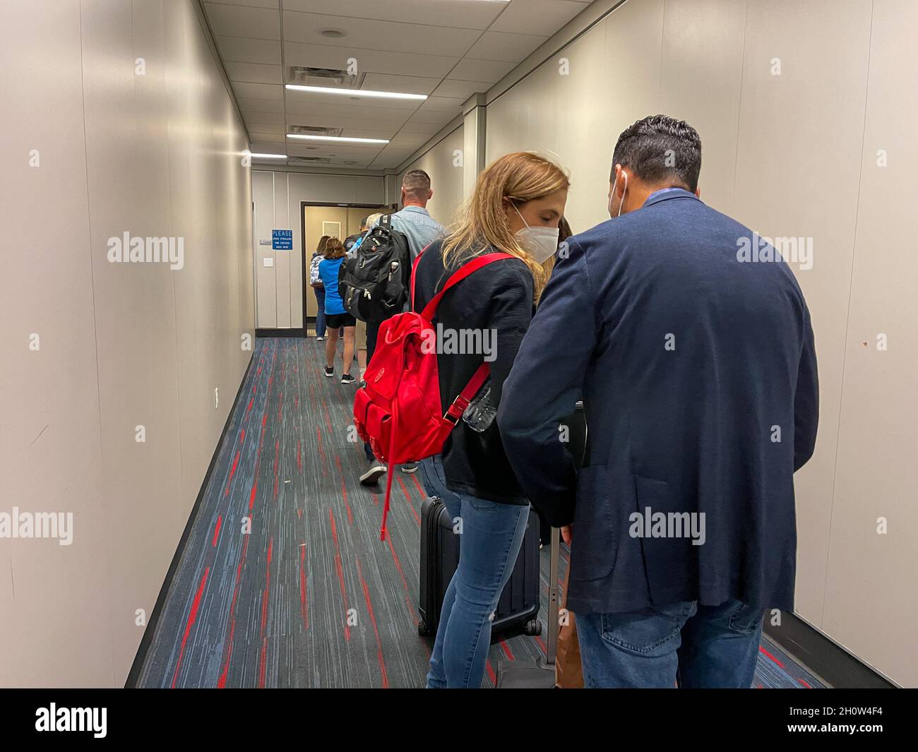 Orlando FL USA - September 26, 2021: People waiting in the jetway to ...