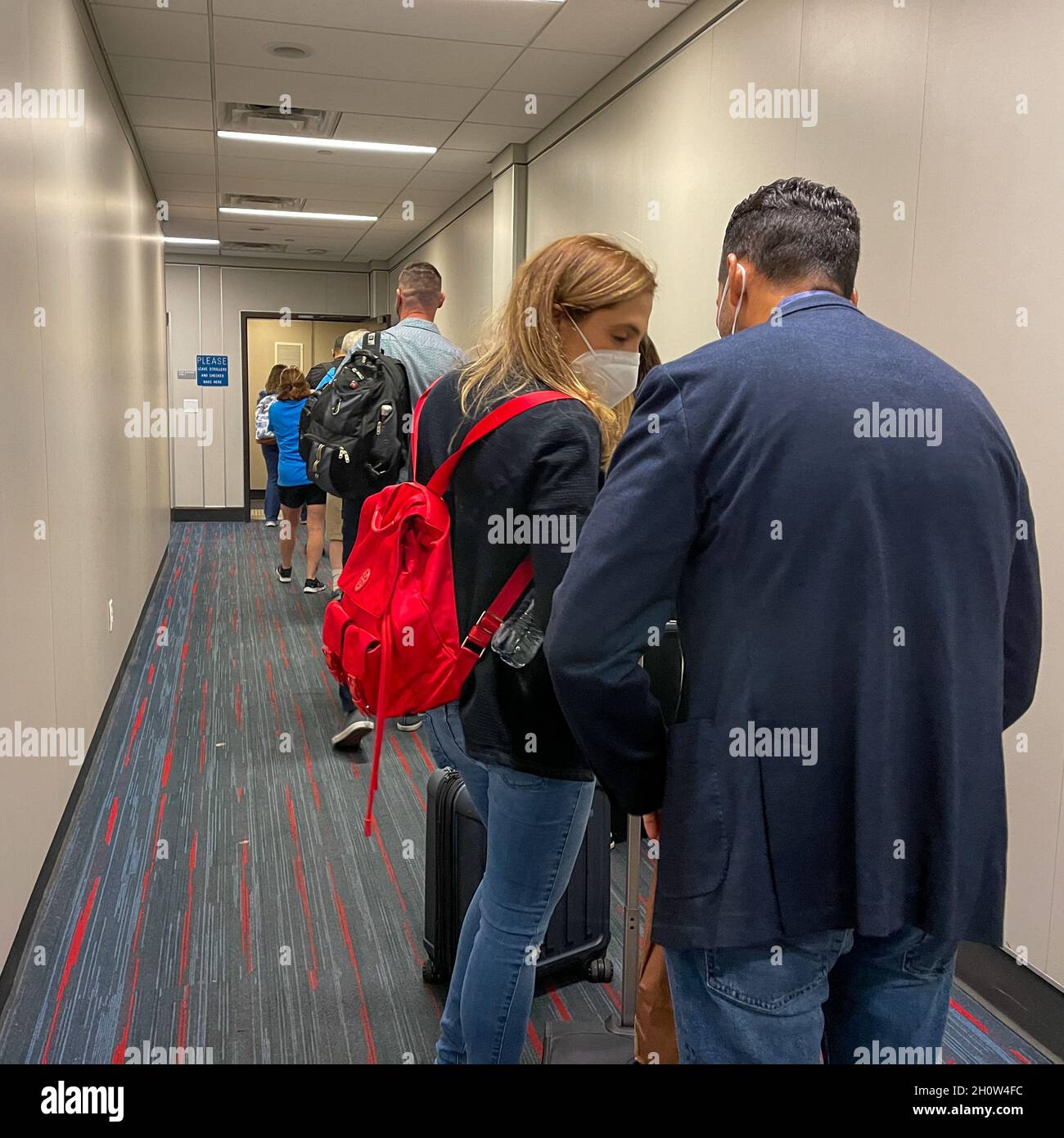 Orlando FL USA - September 26, 2021: People waiting in the jetway to ...