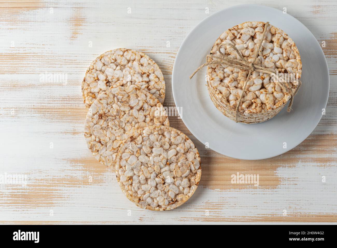 Crunchy rice cakes on white wooden table. Food background Stock Photo ...