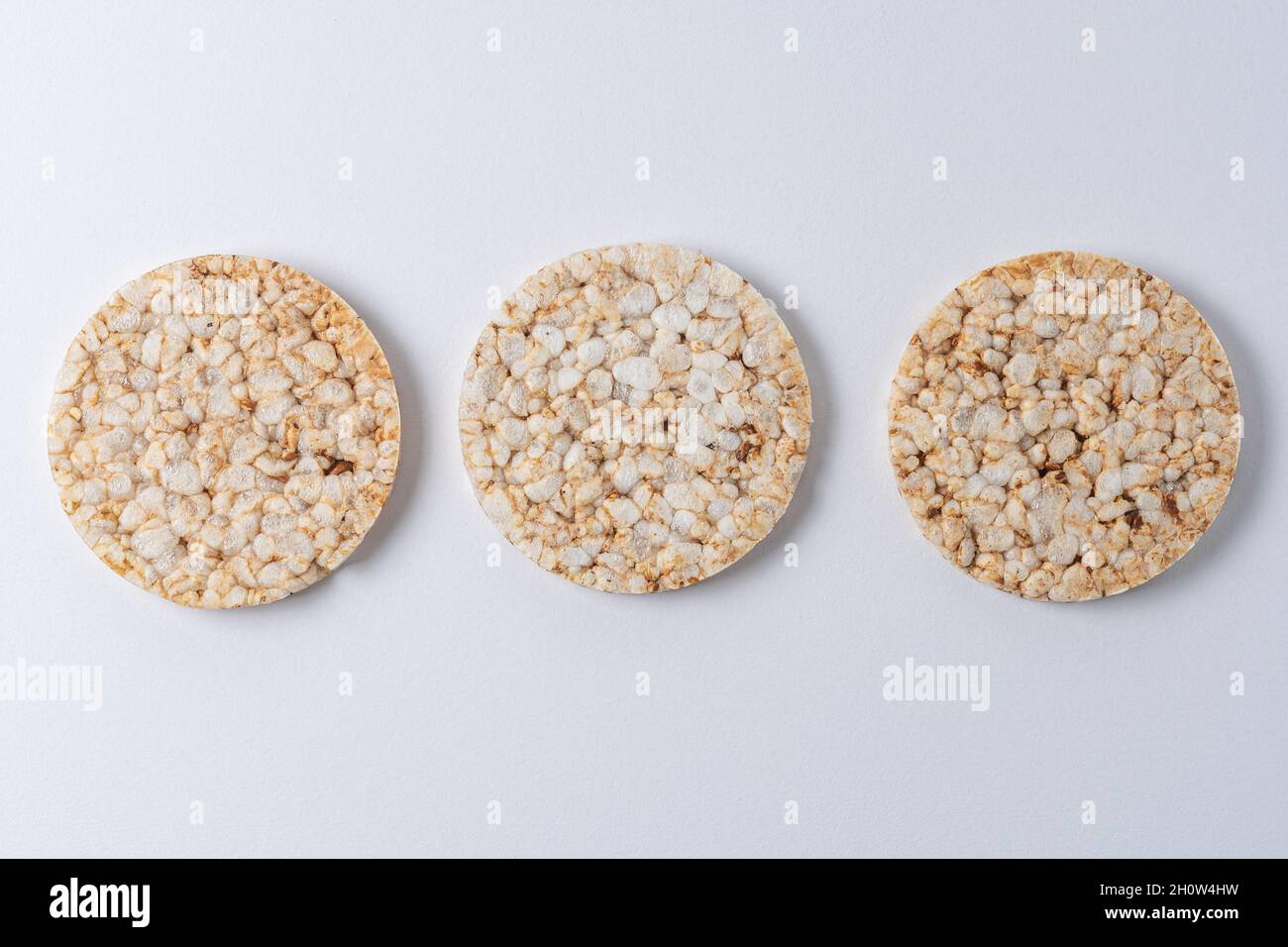 Pile of three rice cakes on white backdrop. Food background Stock Photo ...