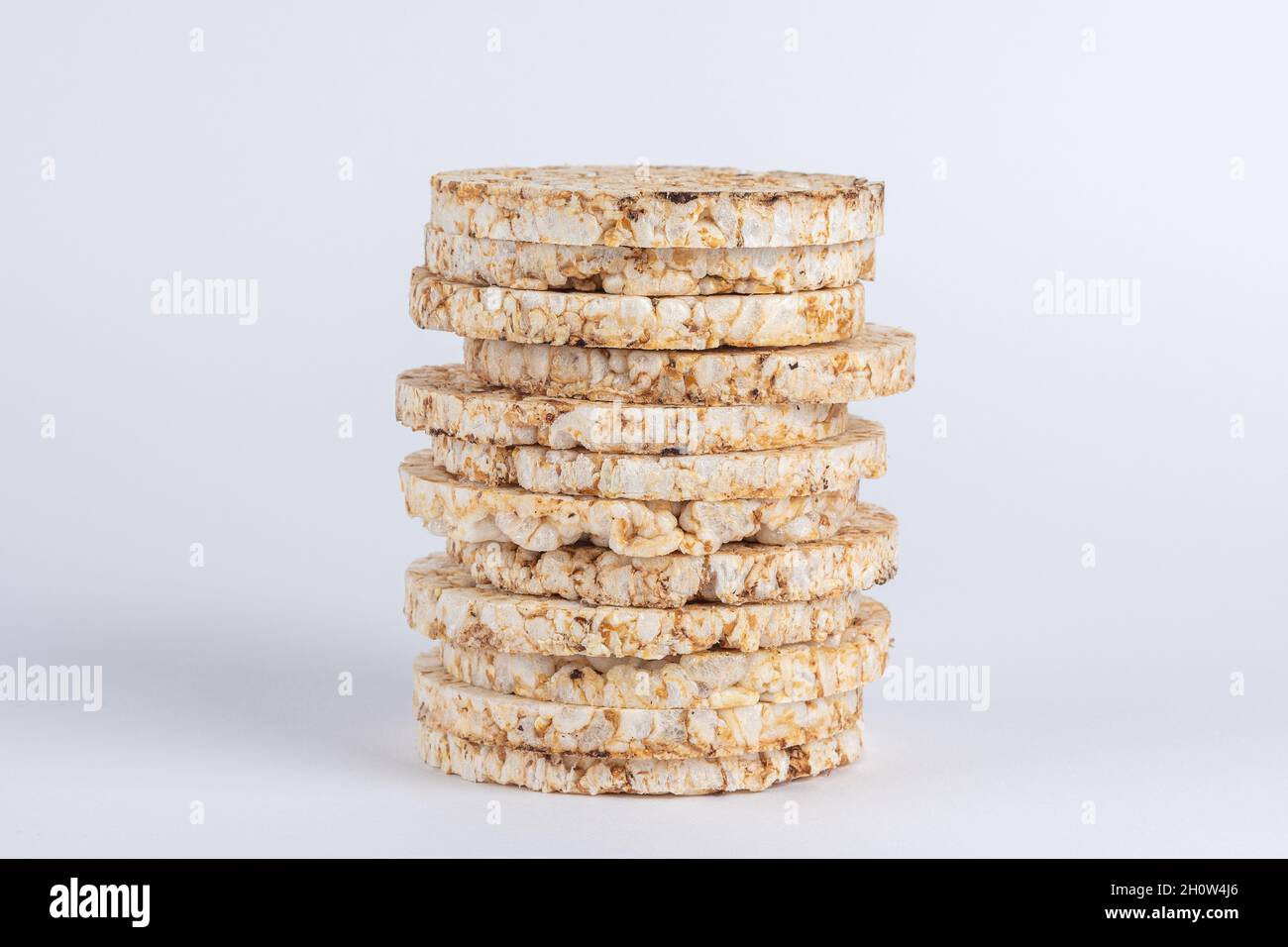 Stack of crunchy rice cakes on white table. Food background Stock Photo ...