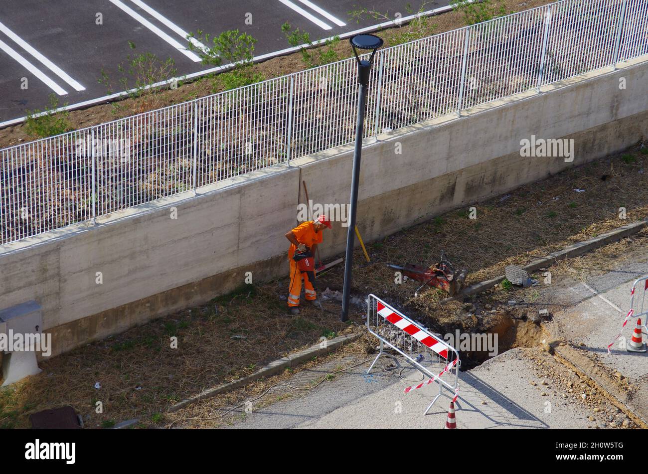 Worker with a demolition hammer in his hand while working Stock Photo ...