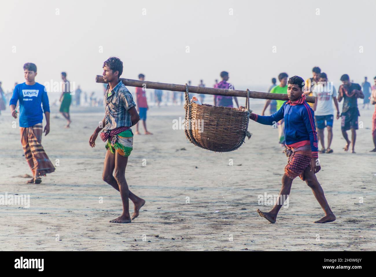 Fishermen carry basket fish hi-res stock photography and images - Alamy