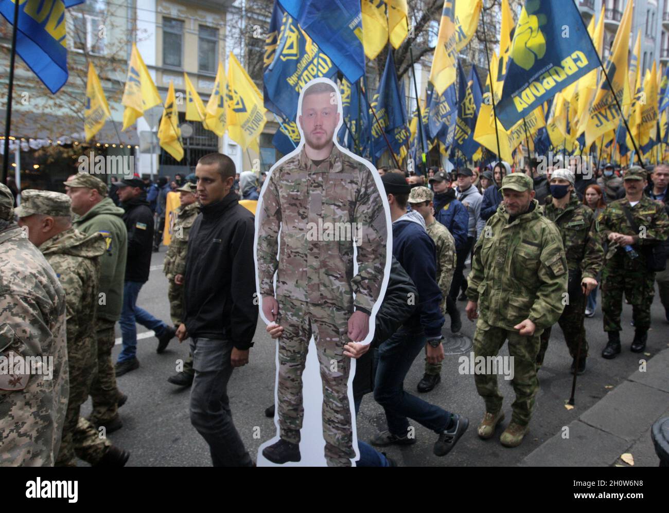 Ukrainian army veterans of the Eastern Ukraine war conflict carry a ...