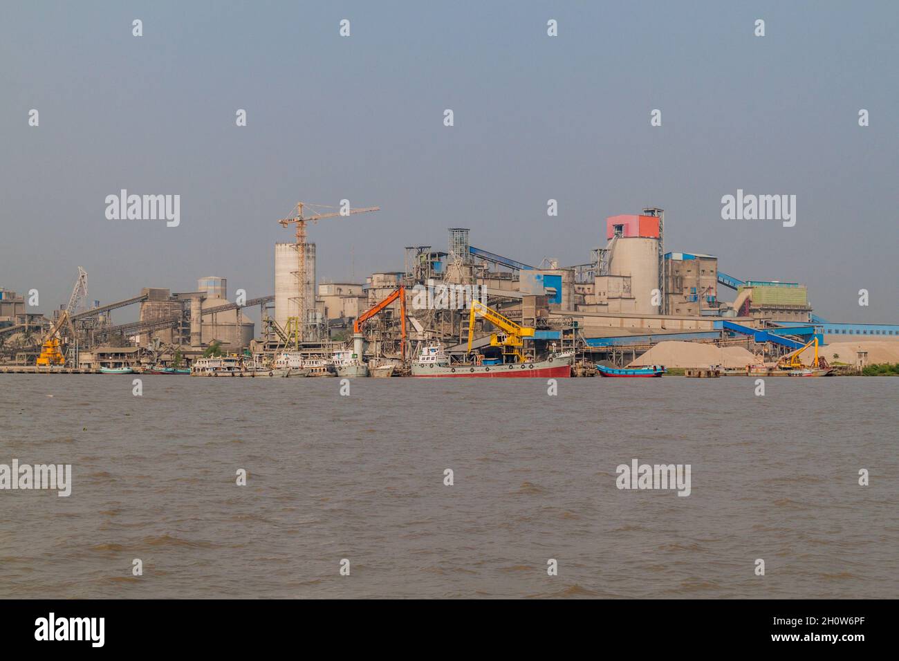 MONGLA, BANGLADESH - NOVEMBER 15, 2016: Cement factory in Mongla Port ...
