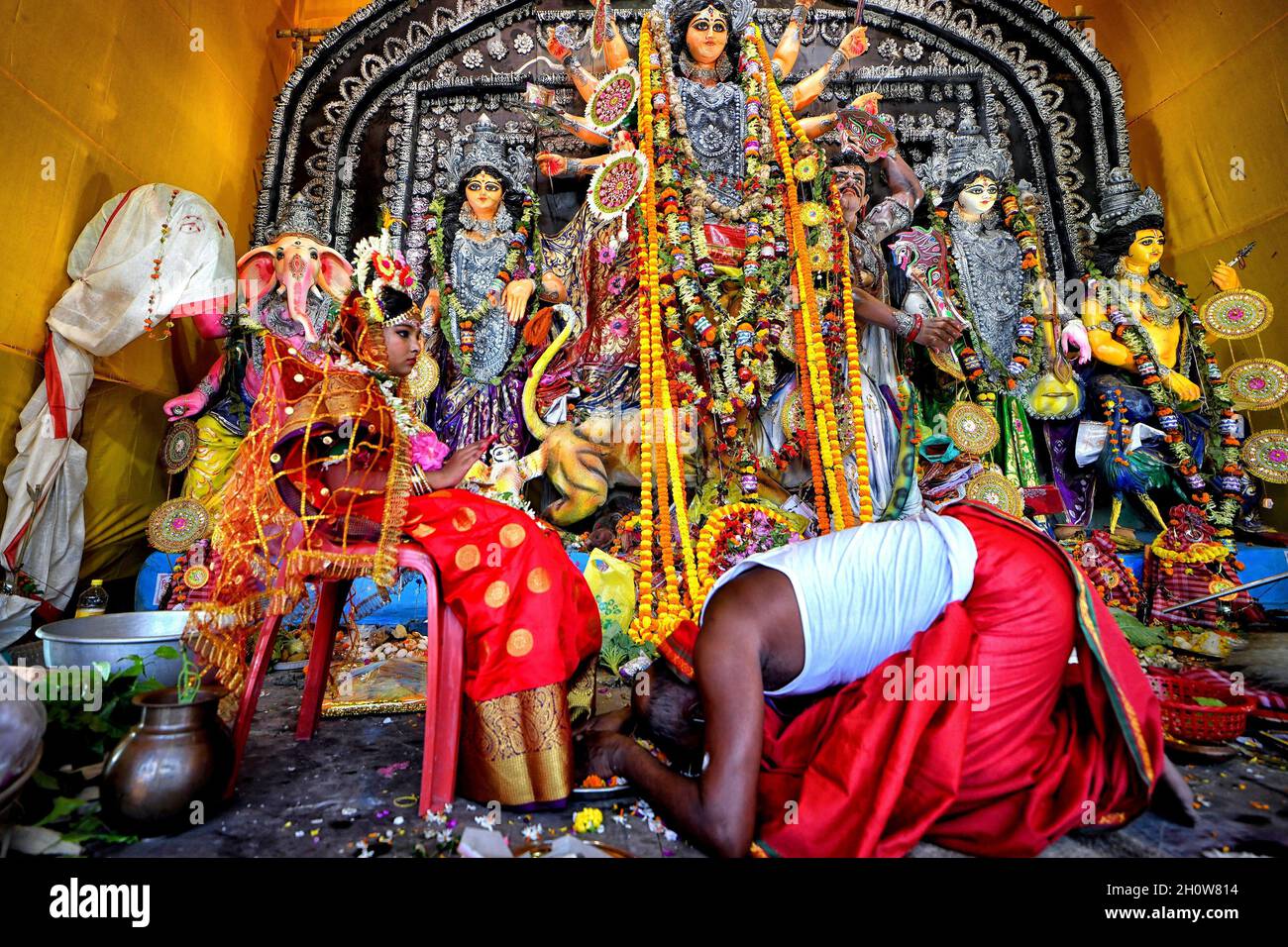 A little girl Dipwantita Adhikary of 10 years is worshipped by the Hindu devotees during the ...
