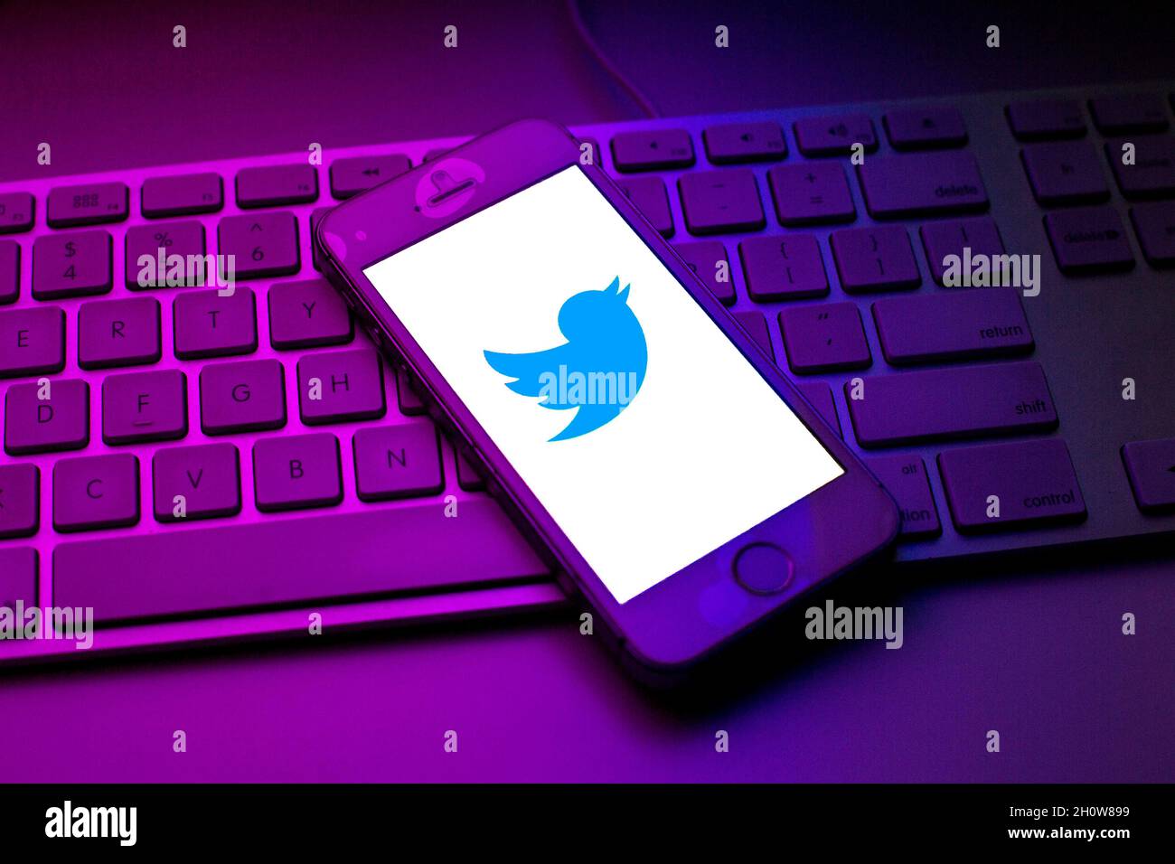 In this photo illustration a Twitter logo seen displayed on a ...