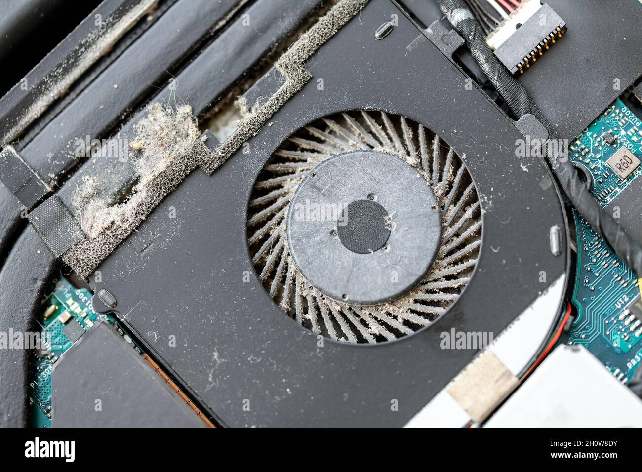 Close-up detail view of disassembled laptop pc motherboatd with dirty ...
