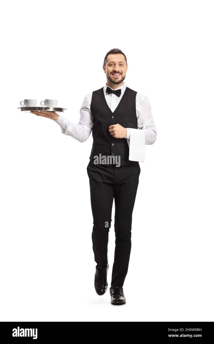 Full Length Portrait Of A Waiter Serving Coffee On A Tray Isolated On White Background Stock