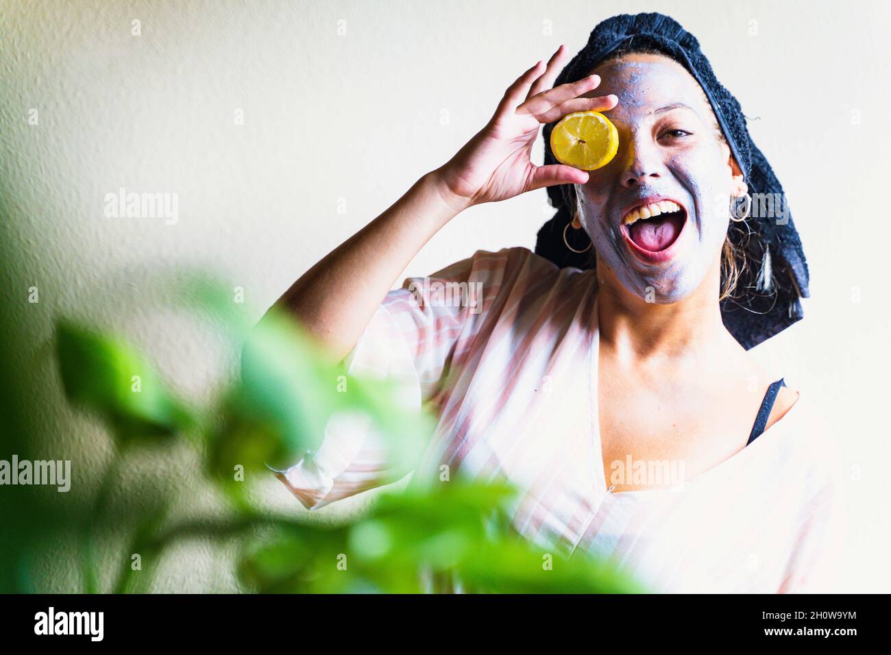 Happy girl applying facial cleanser mask Stock Photo - Alamy