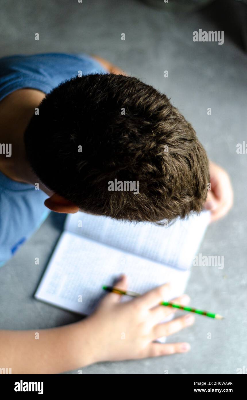 teen doing homework top view Stock Photo - Alamy