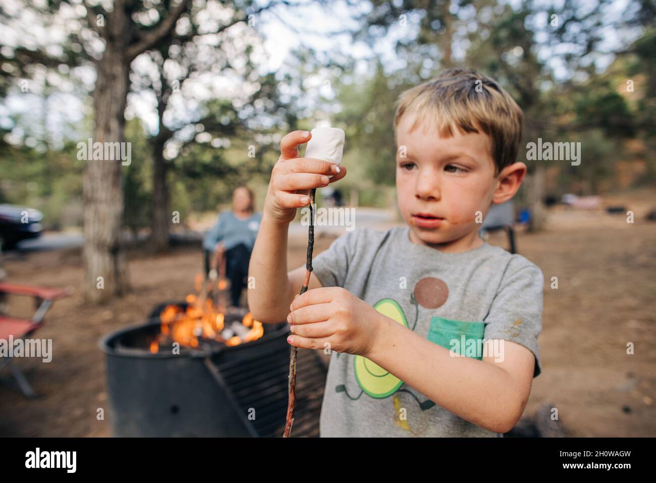Boy eating smores hi-res stock photography and images - Alamy
