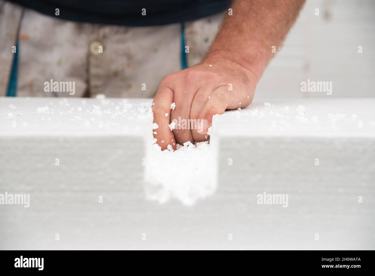 Cleaning and braking styrofoam with hands Stock Photo - Alamy