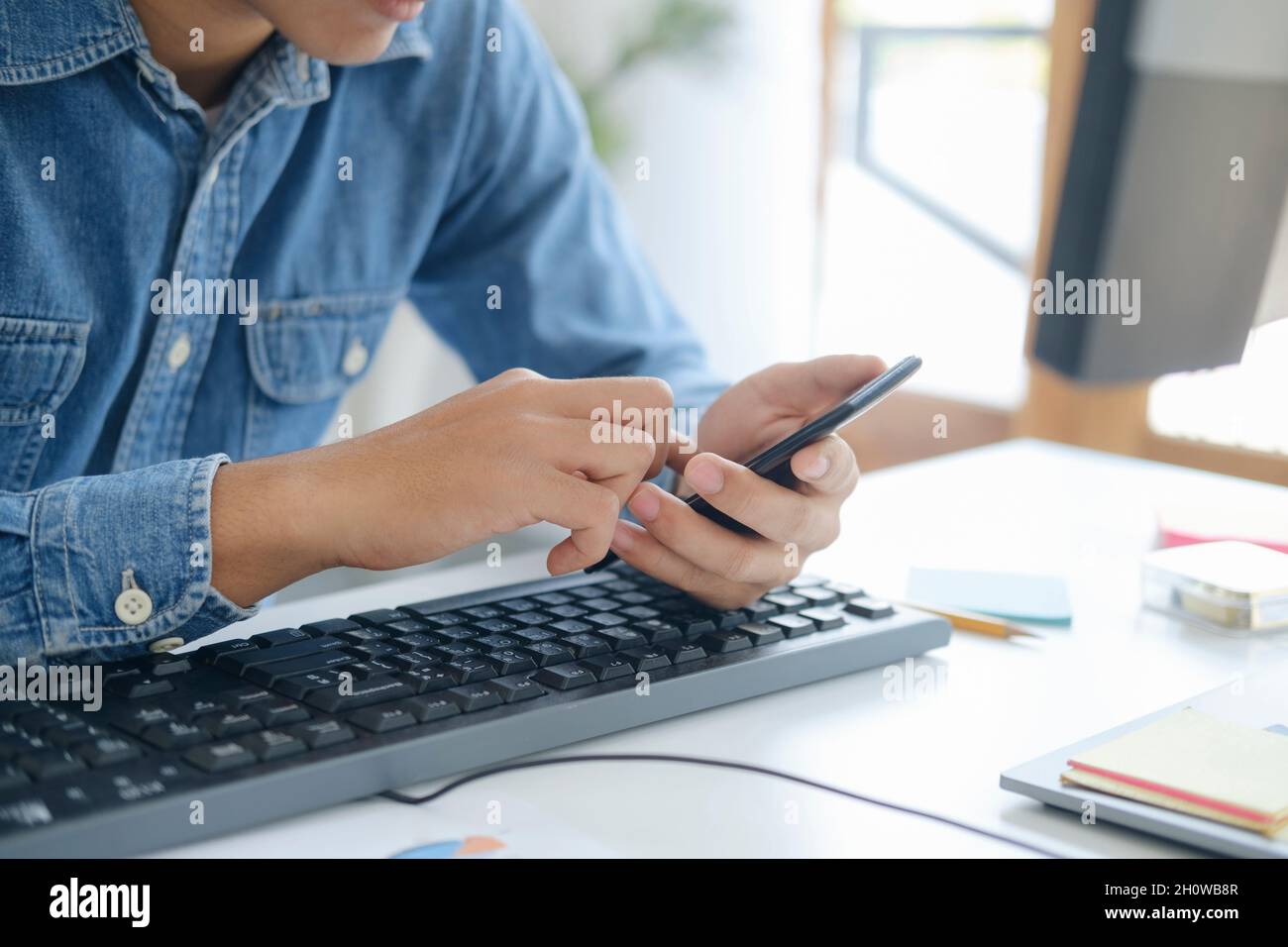 Young man using mobile phone. Using online connect technology for ...