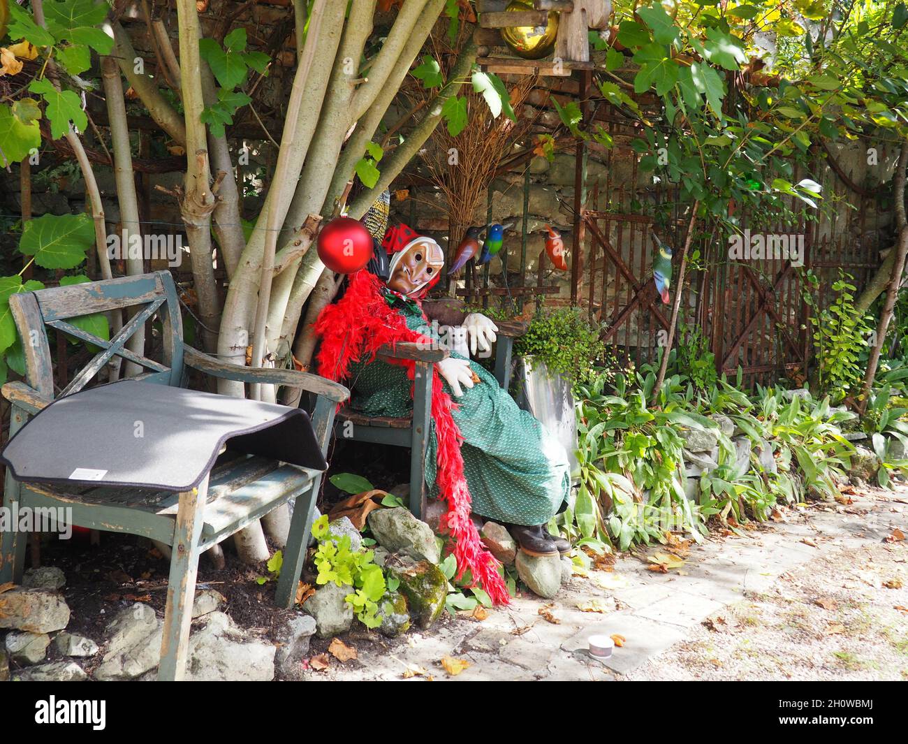 Witch costume sitting on a bench Stock Photo - Alamy