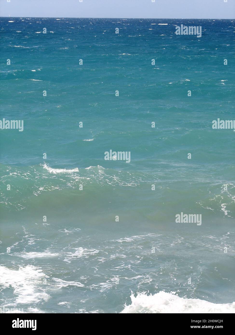 Vertical shot of waves in clear water in Crete, Greece Stock Photo - Alamy