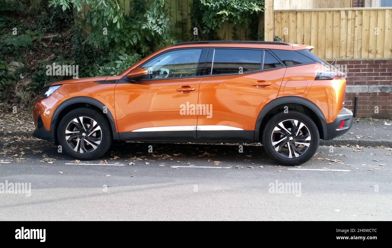 An orange 2020 registered Peugeot 2008 SUV parked in Torquay, Devon ...