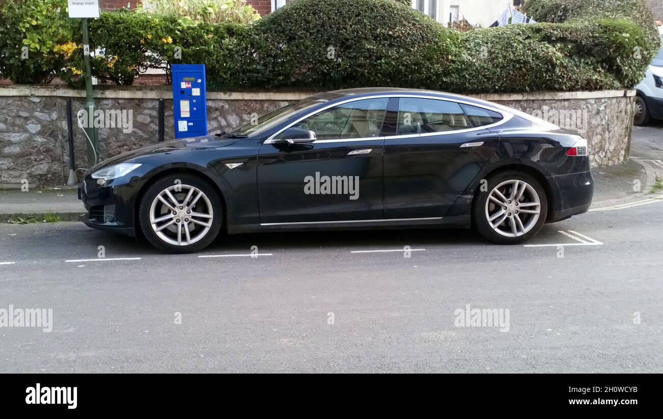A black 2015 registered Tesla Model S electric powered car parked in ...