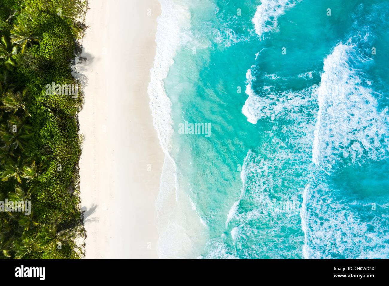 Aerial view of the island's beach and turquoise water. Seychelles ...