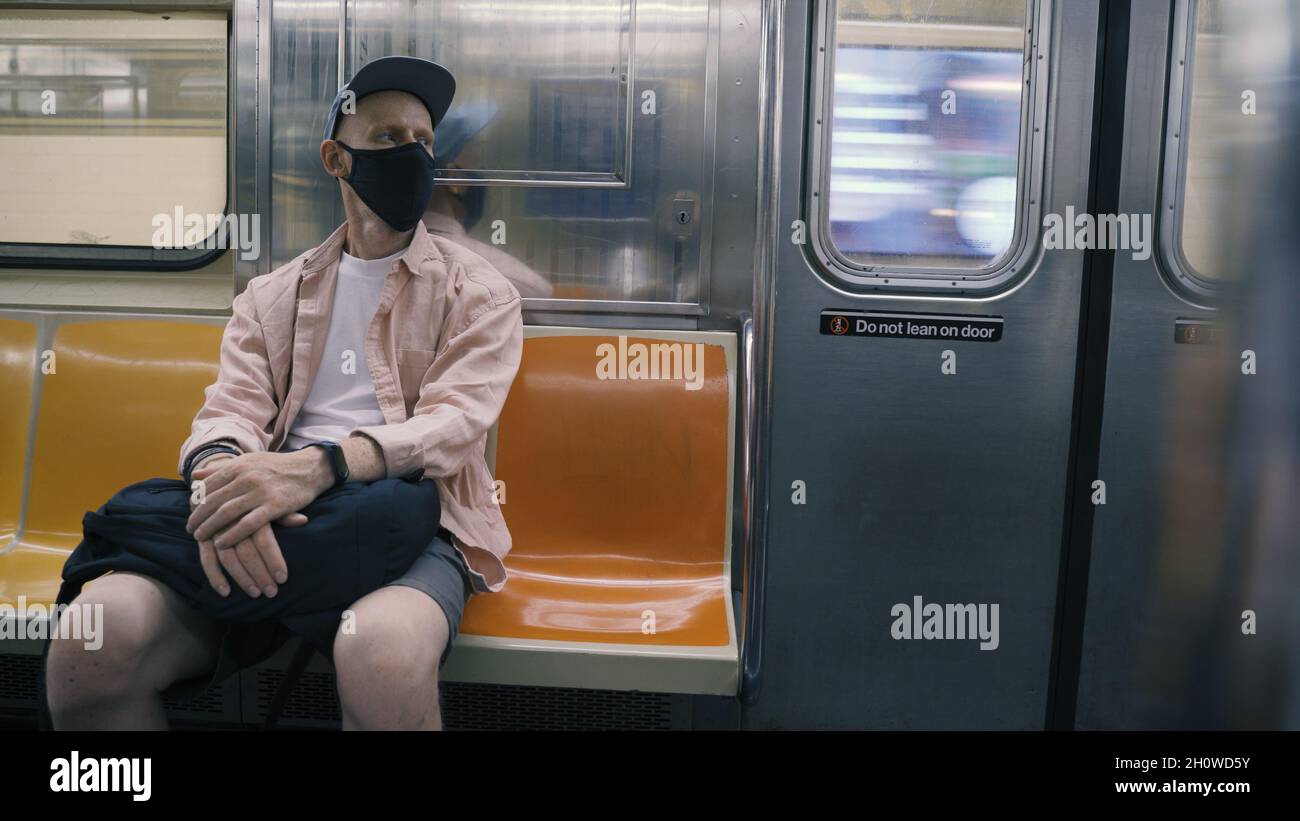 Man uses medical face mask, sits alone in metro carriage, commutes to ...