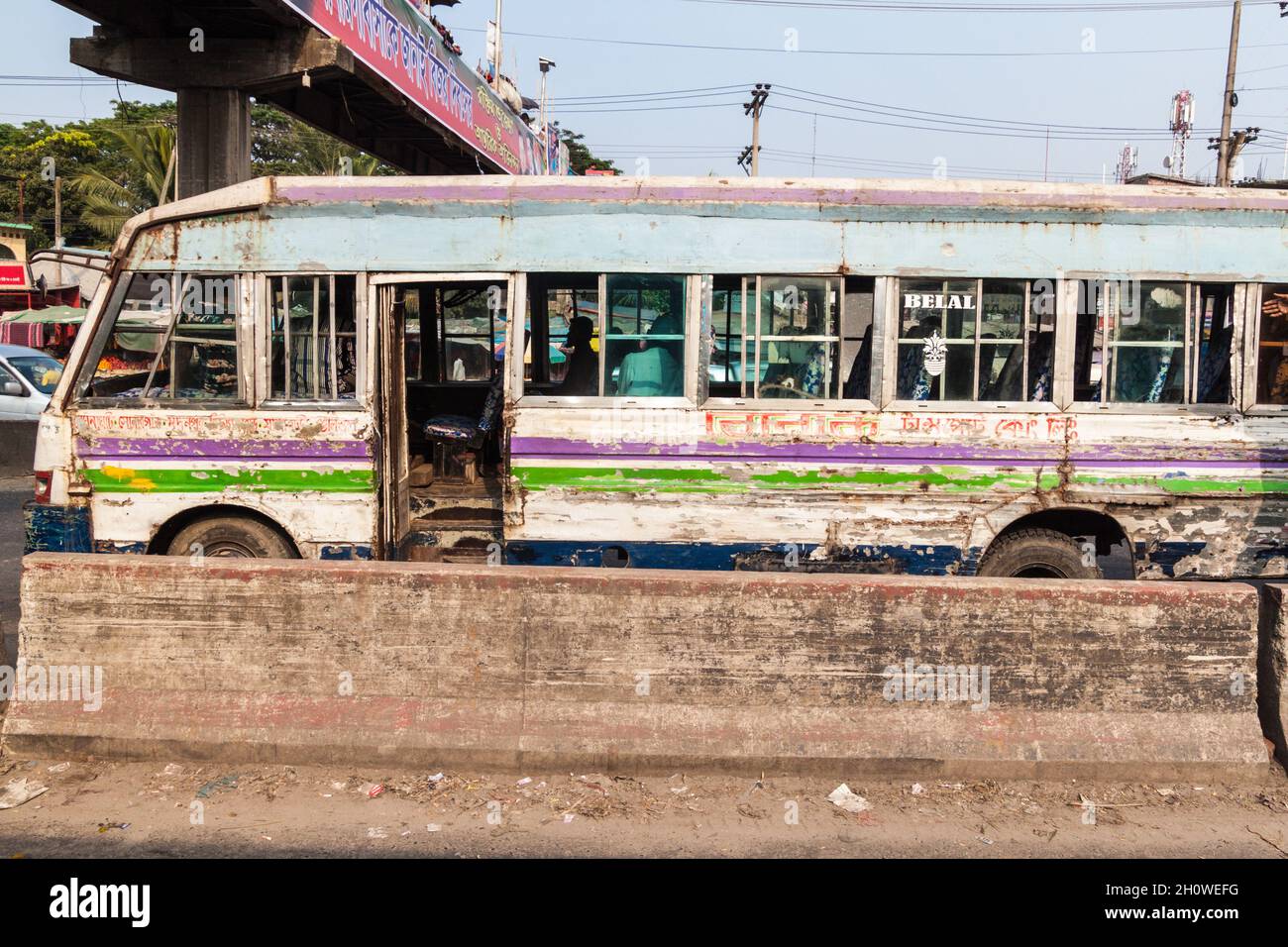 DHAKA, BANGLADESH - NOVEMBER 21, 2016: View of a severely battered bus ...