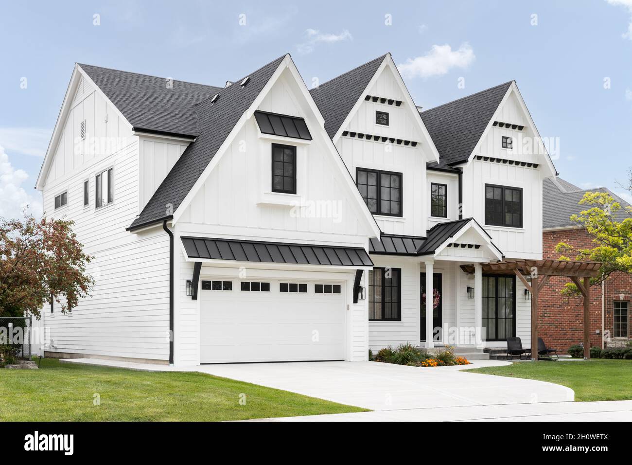 Modern White Farmhouse With Black Windows