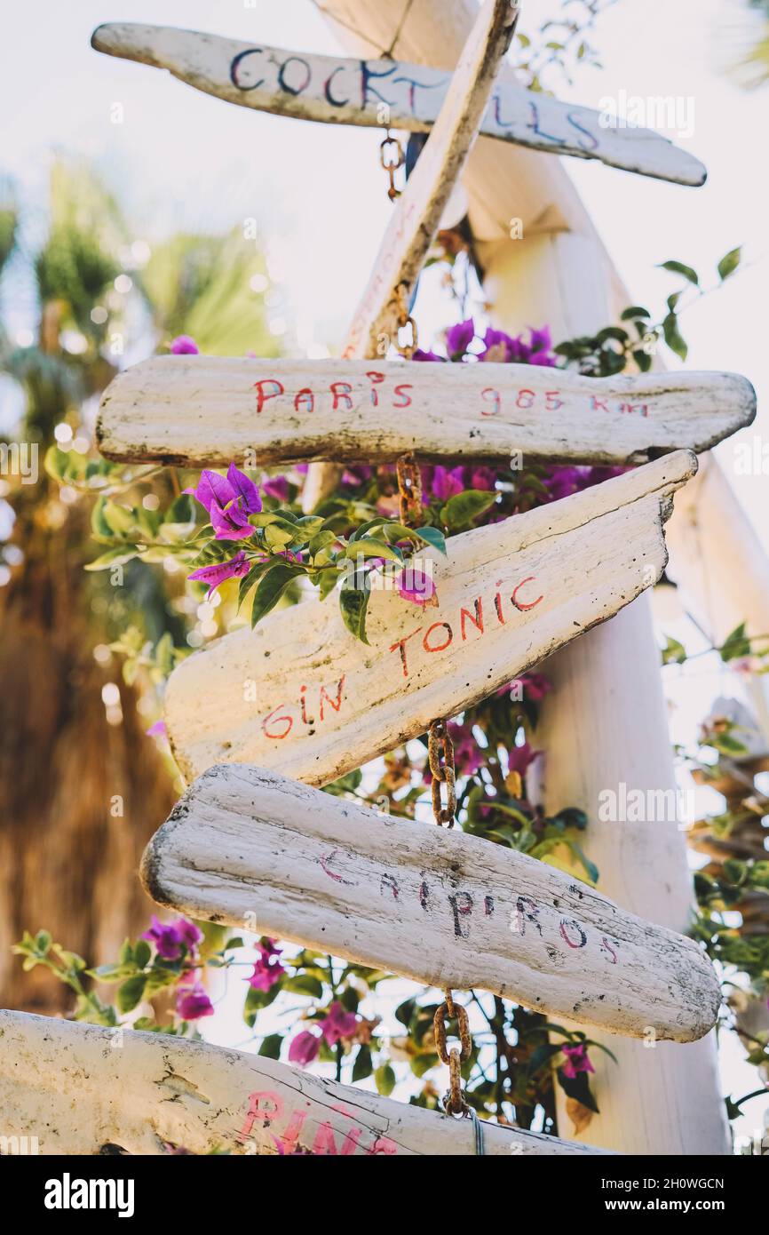 Signs indicating directions made by hand with wood Stock Photo - Alamy