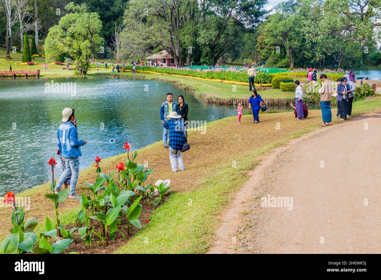 PYIN OO LWIN, MYANMAR - NOVEMBER 29, 2016: Flowers and a lake in ...
