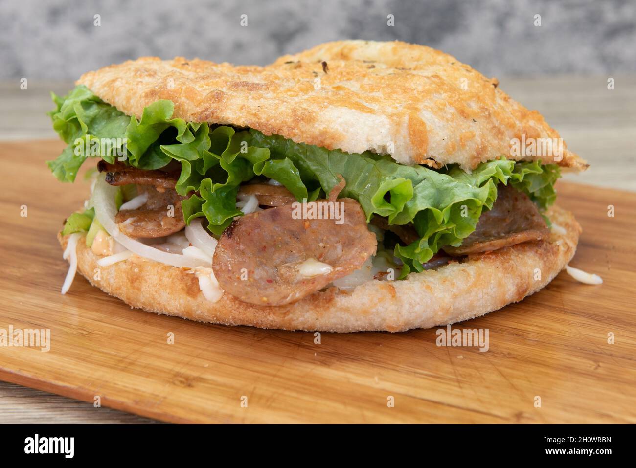 Freshly baked panuozzo pizza sandwich with all the toppings inside ...