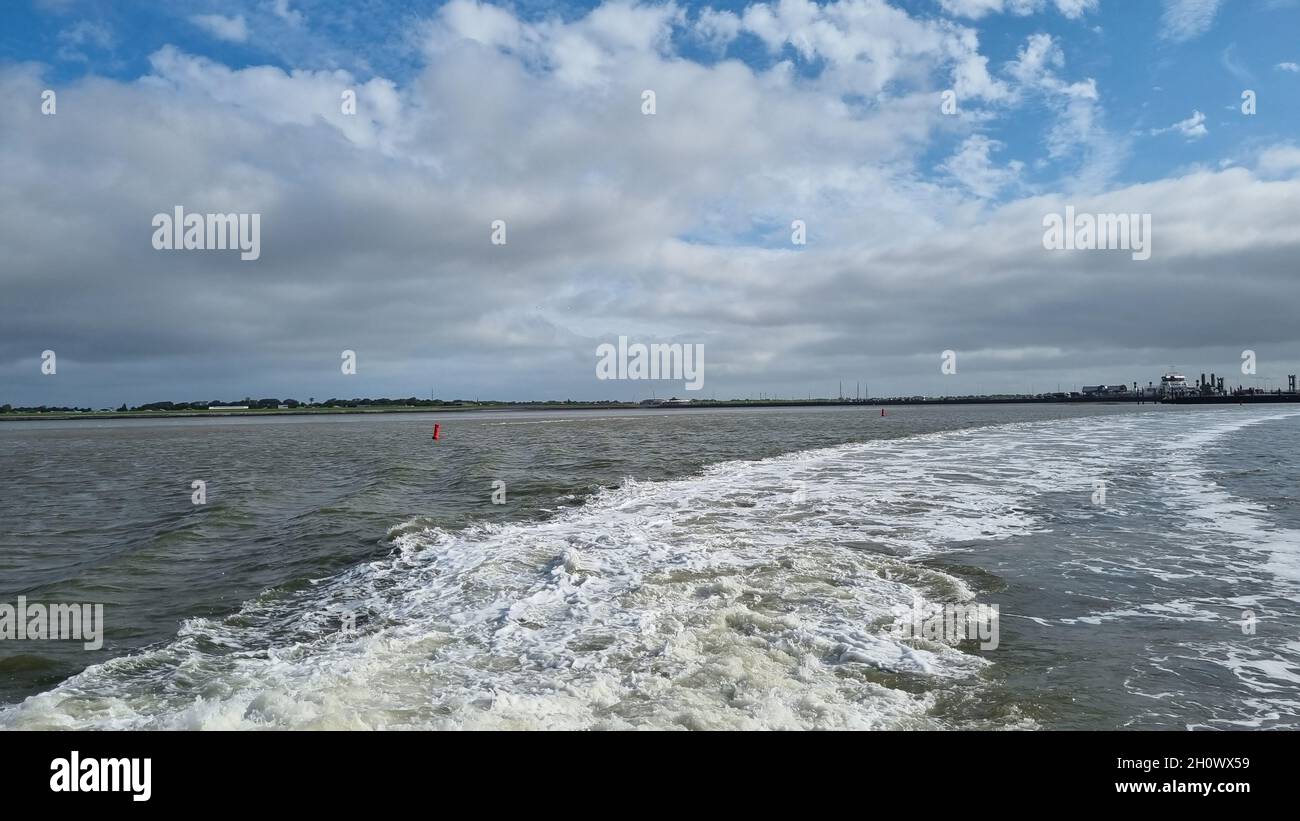 Seawater ripple on the beach at sunrise Stock Photo - Alamy