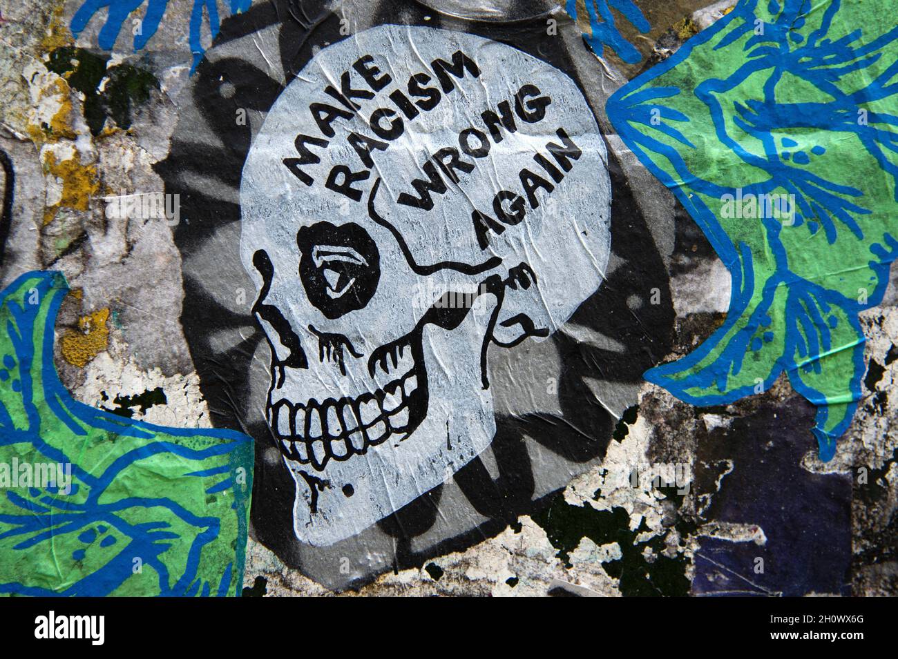 London, UK. Oct 14 2021: A street art piece showing a skull on which is ...