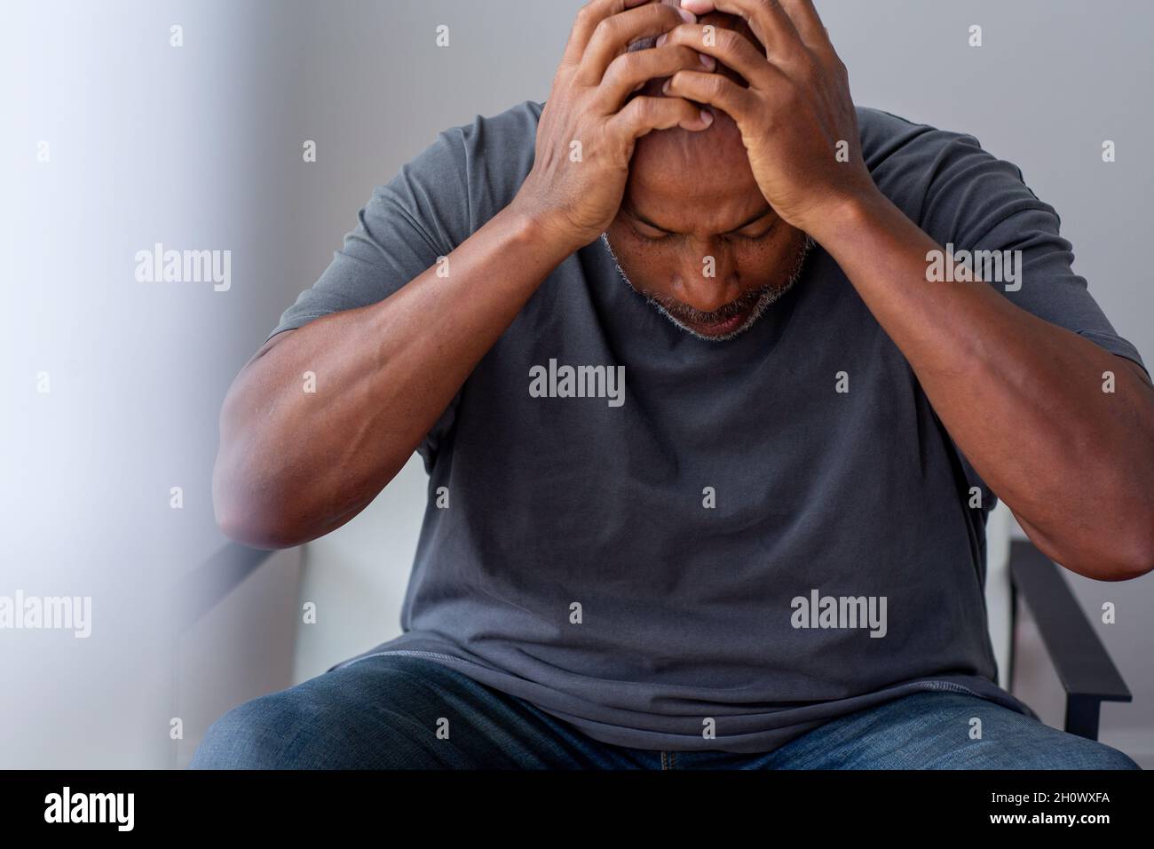 Older man not feeling well and having a headache Stock Photo - Alamy