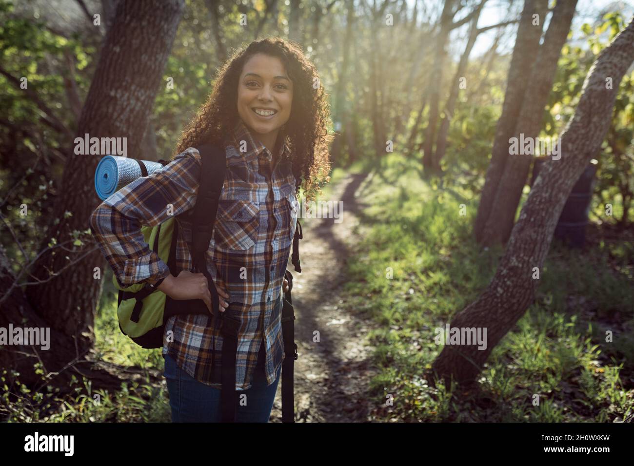 Happy active woman backpack hi-res stock photography and images - Alamy