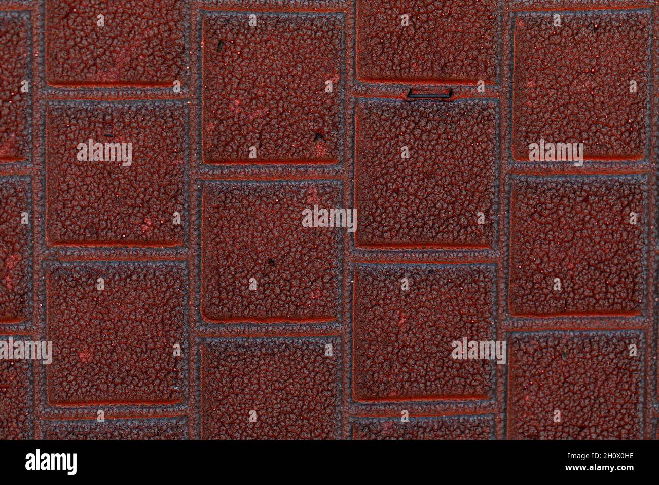red square stone background. Rough textures of some building material ...