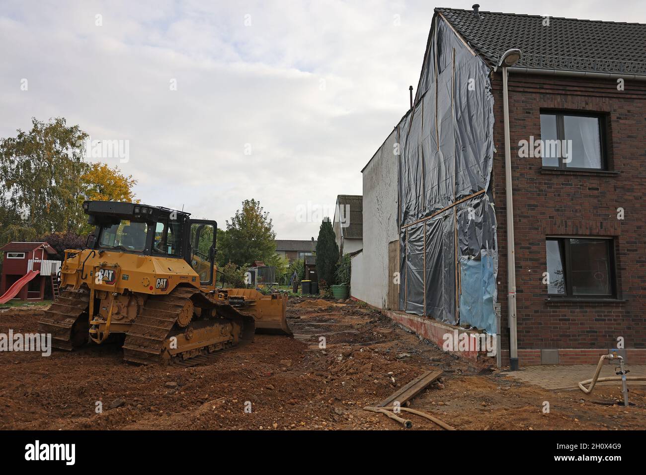 Erftstadt, Germany. 13th Oct, 2021. An excavator levels earth at the ...