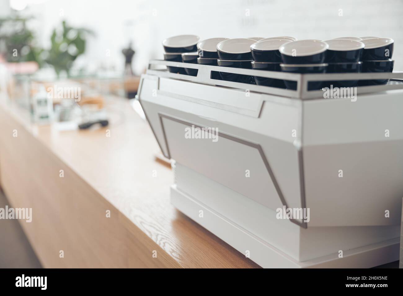 Collection of coffee cups on counter in cafe Stock Photo - Alamy